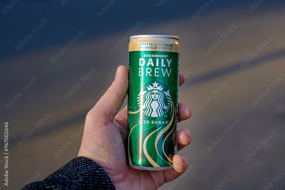 Minsk, Belarus. Mar 2, 2024. Can of Starbucks coffee in hand. Man`s ...