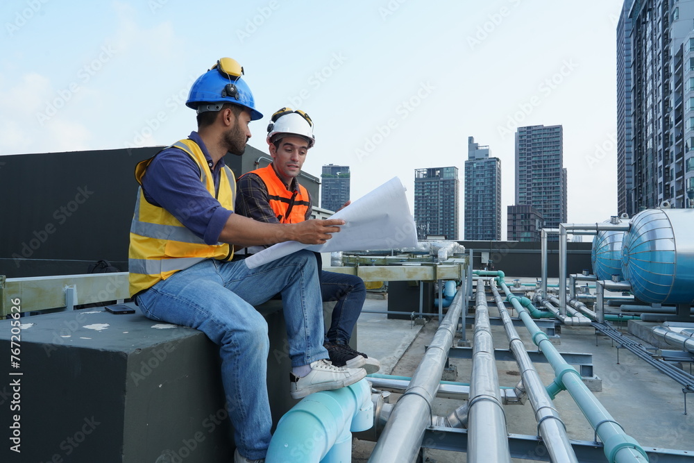 Foreman engineer and contractor engineer wearing reflective jacket ...