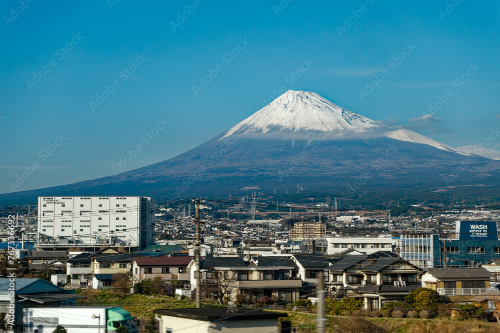 Scenic view of famous volcano Mount Fuji seen trough window train with ...