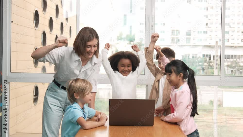 Group of diverse student and teacher celebrate successful project ...
