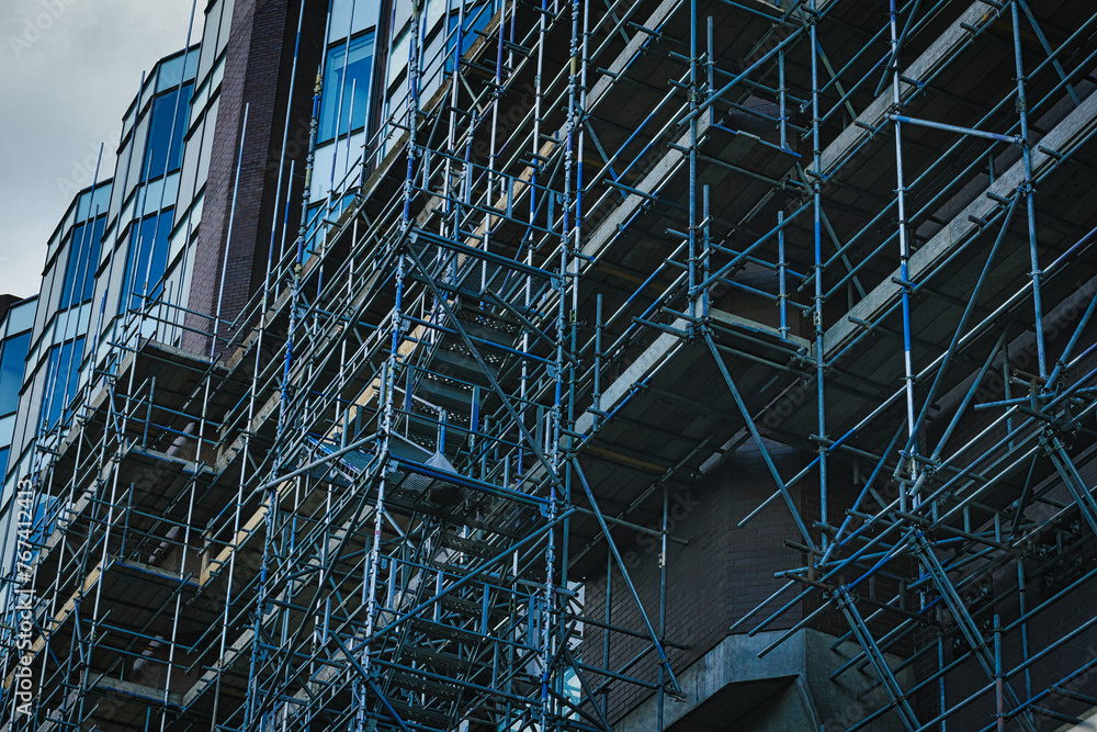 Complex network of metal scaffolding on the exterior of a modern ...