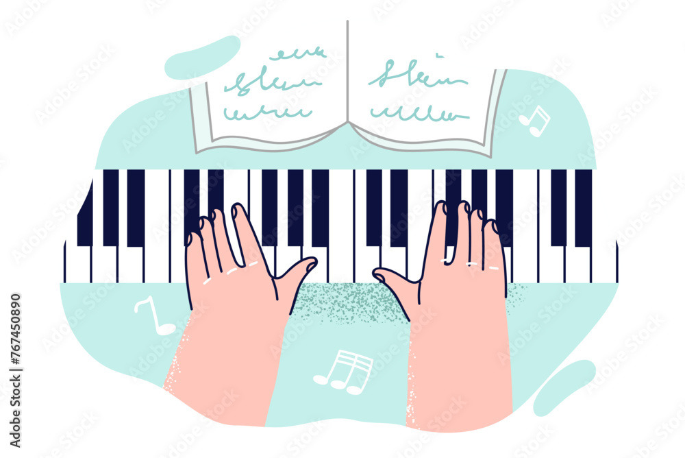 Hands of composer playing piano and learning notes for performance at ...