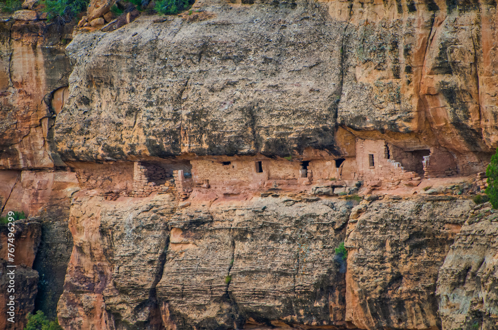 A stunning view of well-preserved ancient cliff dwellings nestled ...
