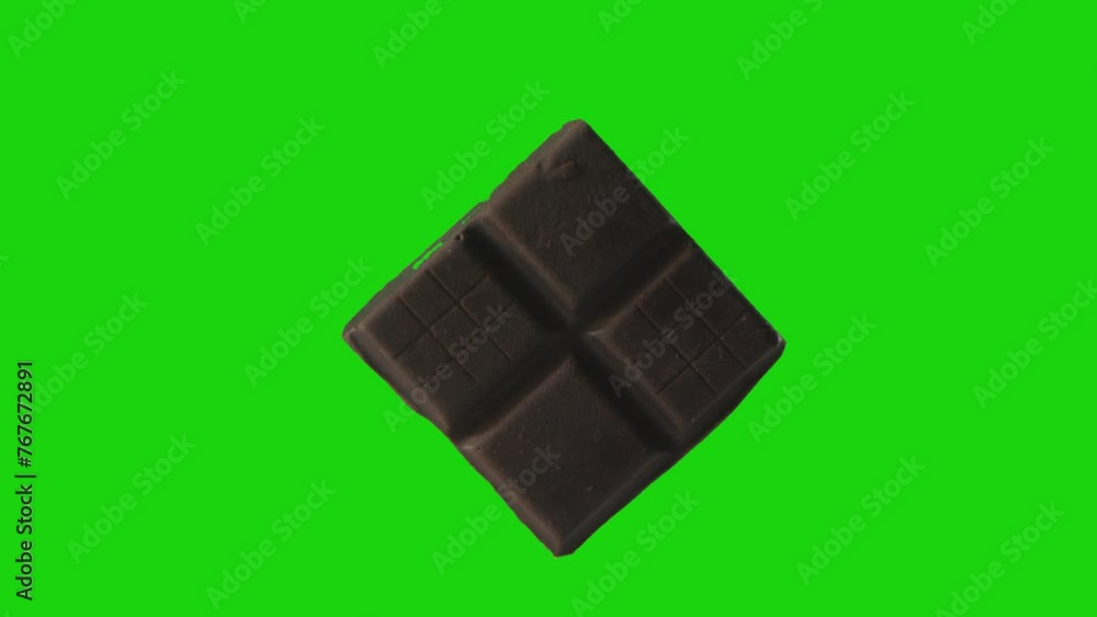 Piece of chocolate candy bar on chromakey green screen background ...