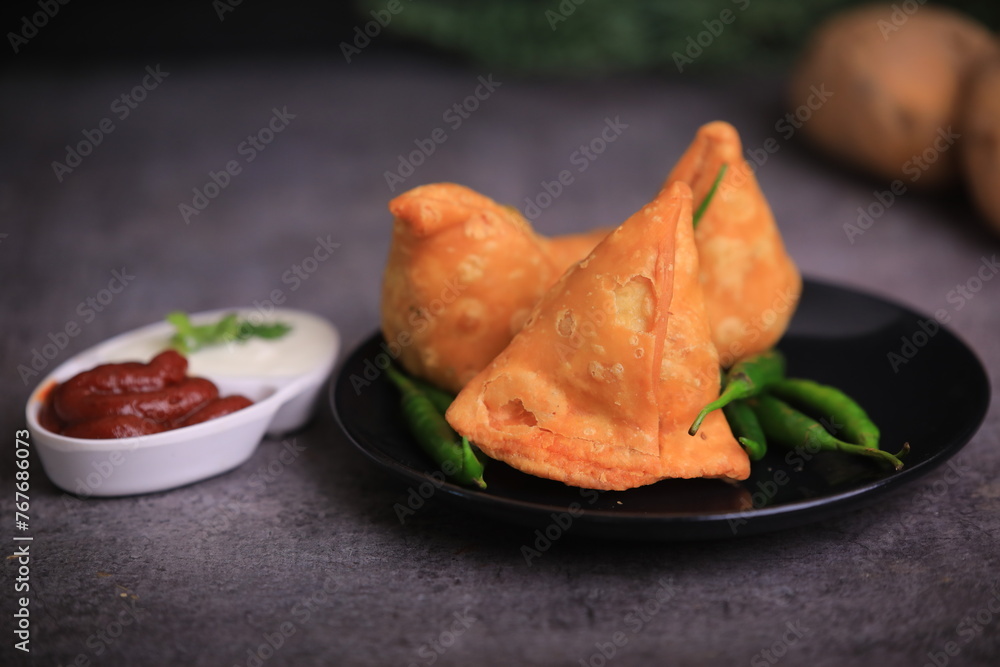 Samosa Indian famous street food snack closeup with selective focus and ...