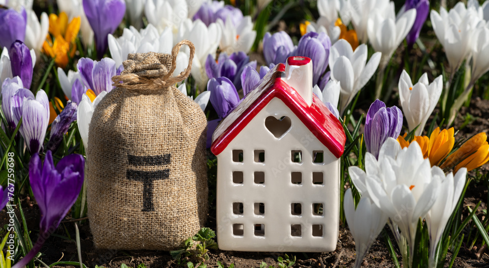 Money bag with the symbol of the Kazakh currency tenge and a symbolic ...