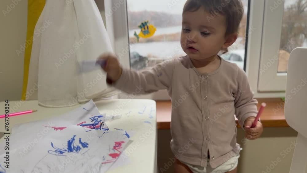 child draws with pencils on a sheet. happy family child dream concept ...