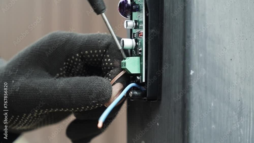 Electrician installs wiring using Connectors for connecting wires in ...