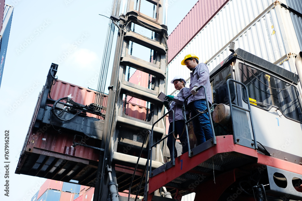 Engineers and employees work at shipping containers or shipping ...