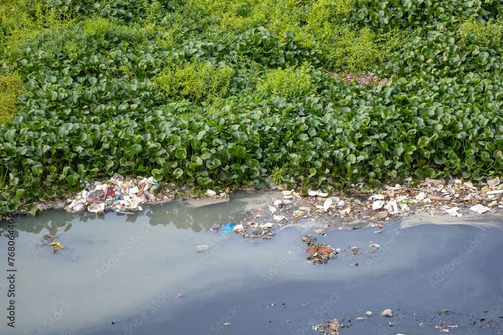 Water pollution in rivers with trash. Human impacts on the environment ...