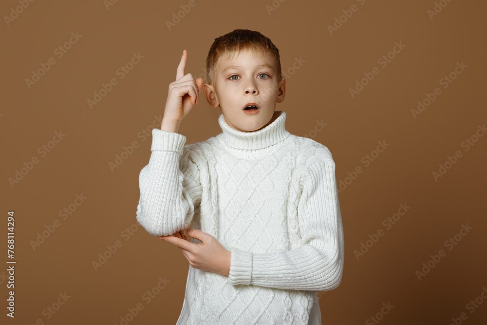 Thoughtful handsome teenager searching for creative solution to problem ...