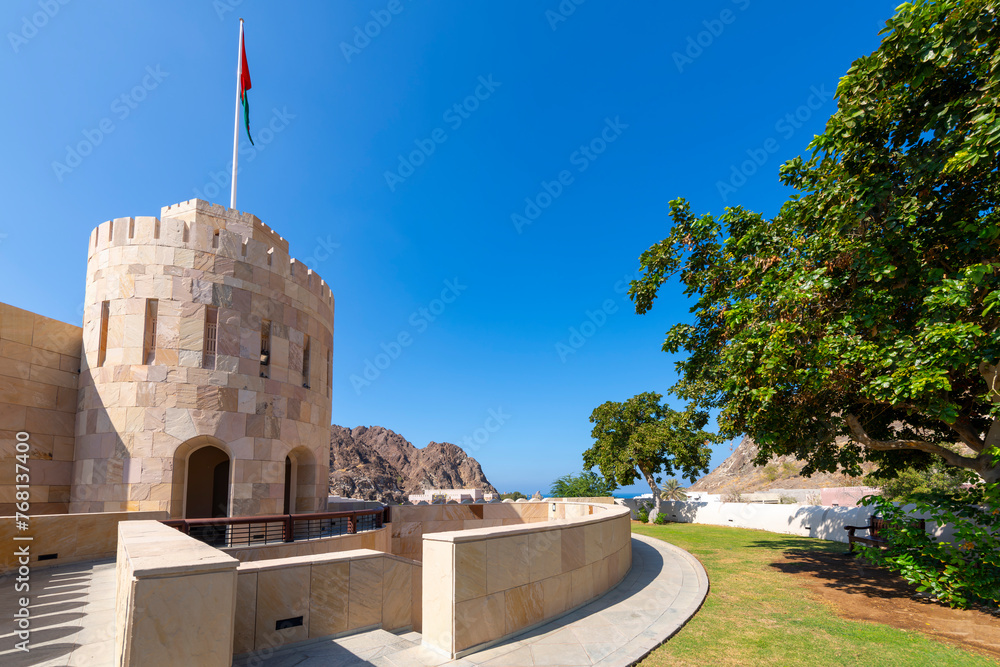 The Muscat Gate Museum with the Omani flag flying on the tower at the ...