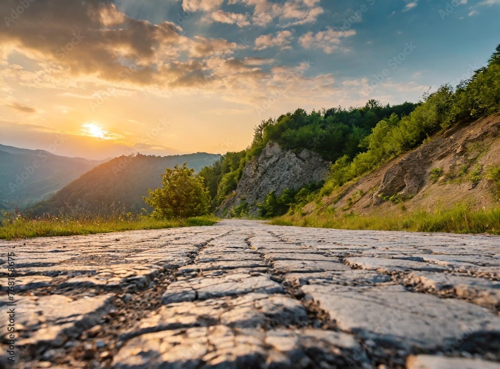 Low level view of empty old paved road in mountain area at sunset Stock ...