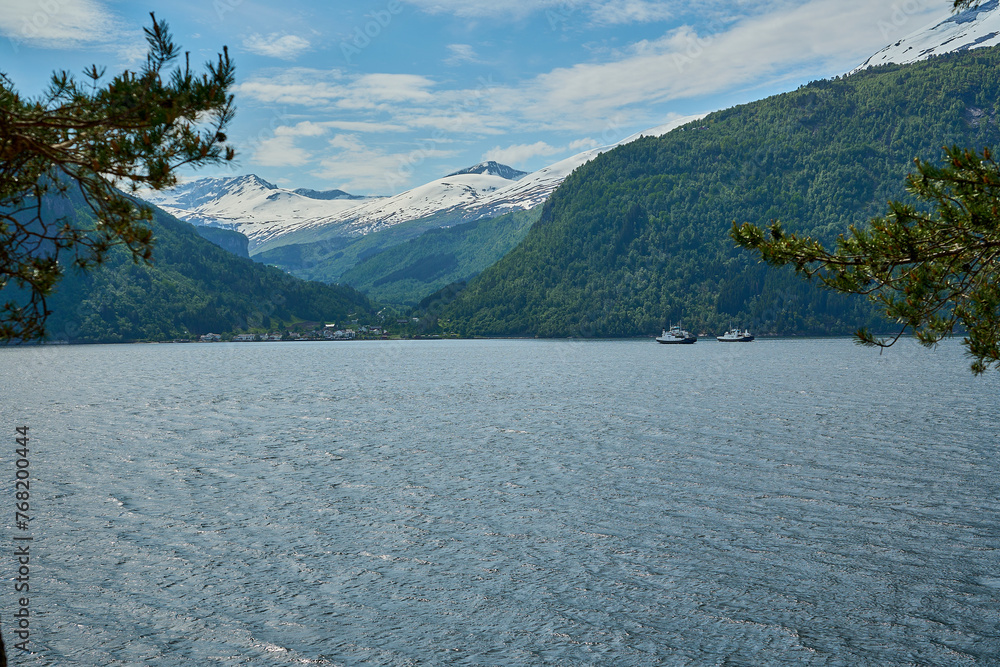 typical norwegian car ferry crossing a beautiful fjord between the ...