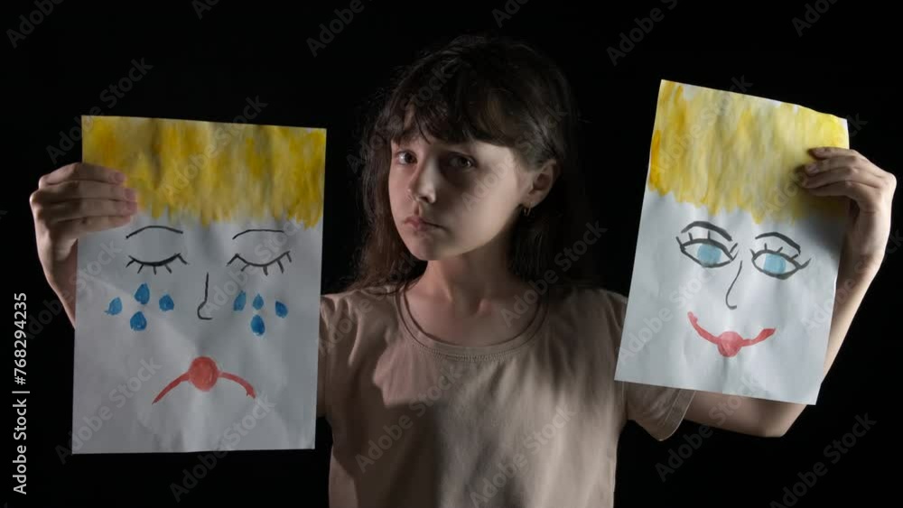 The choice of the child's emotions. An emotional little girl look at ...