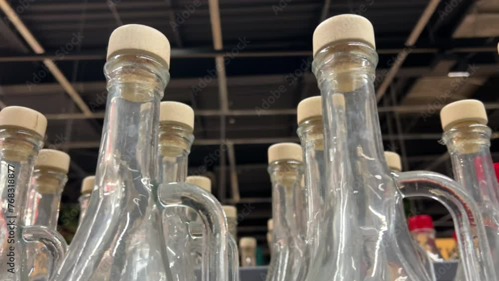 Handled Glass Bottles Display at Glassware Store: Versatile Containers ...