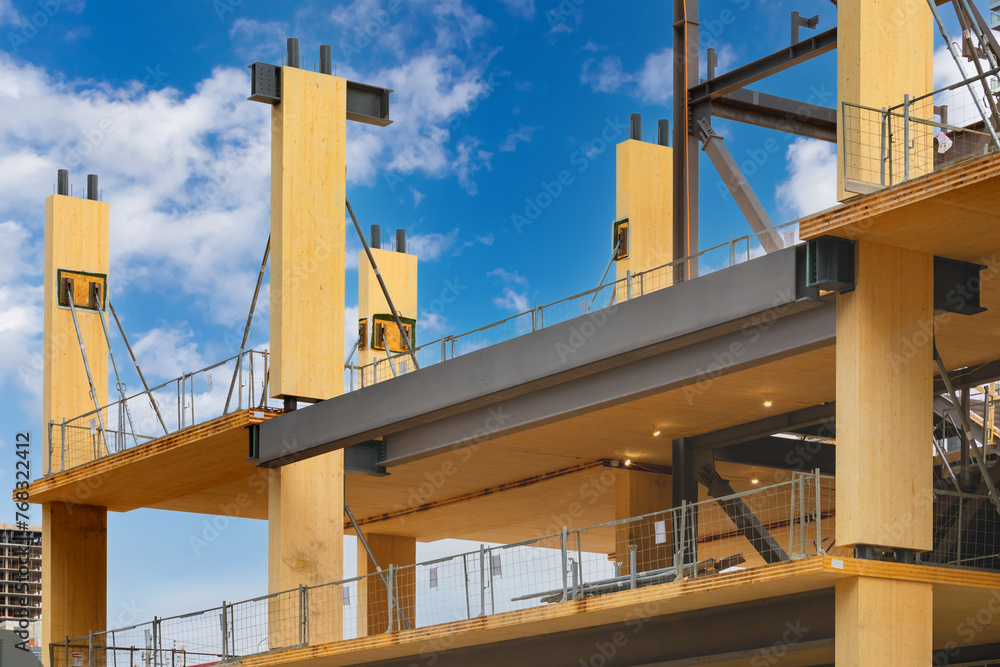 laminated support columns and floor panels with structural steel ...