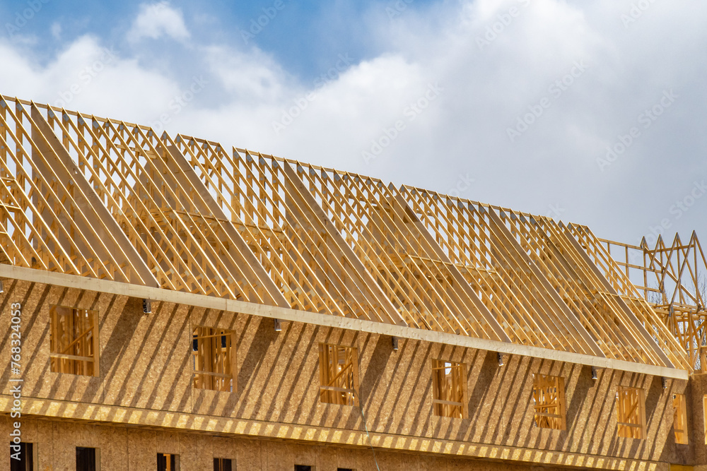 A multi unit residential construction project showing roof trusses ...