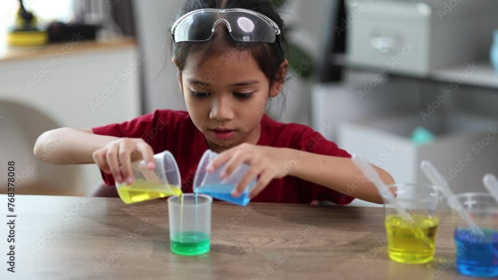 Asian child girl learning science chemistry with test tube making ...