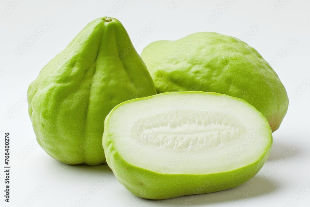 Whole and Half-Cut Chayote Squash on a Clean White Background Stock ...
