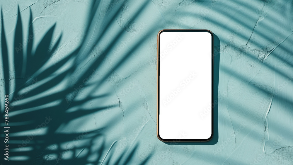 Smartphone with a transparent screen with the shadow of palm leaves ...