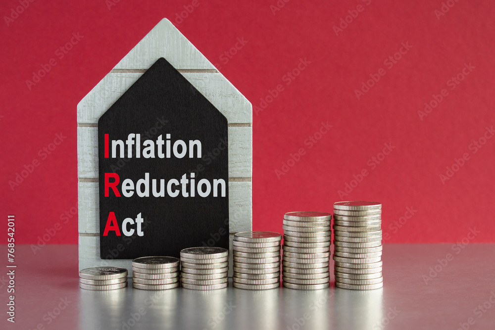 IRA inflation reduction act symbol. Concept words inflation reduction act on a black board ...