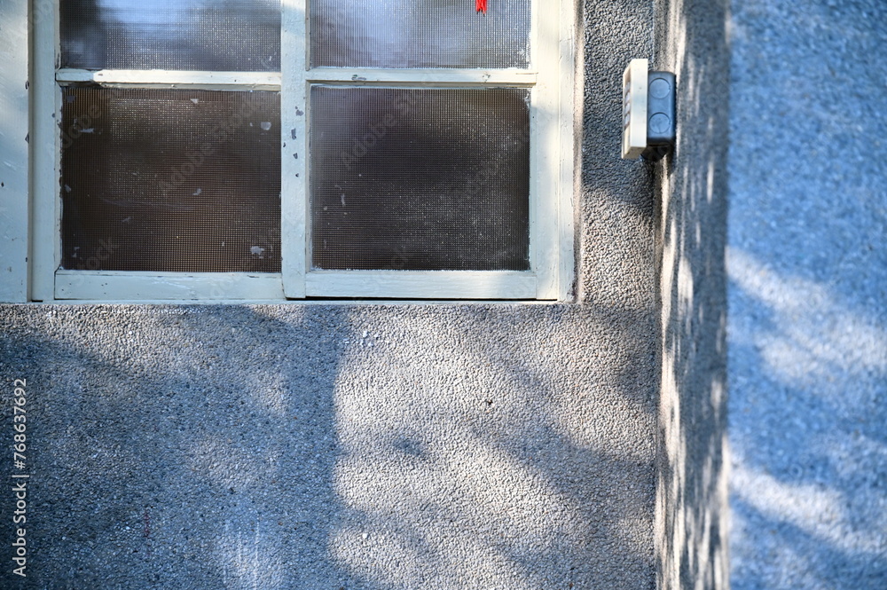 An exposed aggregate finish wall, reminiscent of times past, stands ...