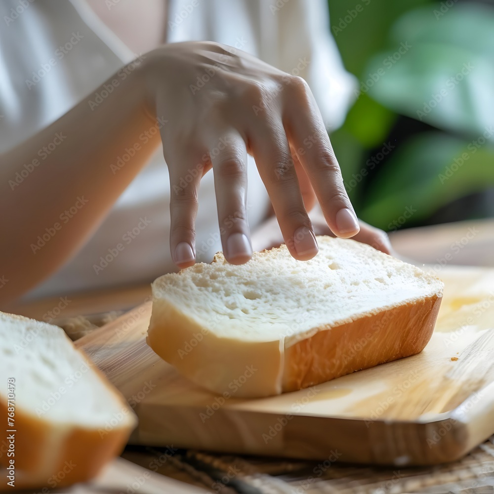 Conceptual image of an Asian woman refusing to eat a slice of white ...