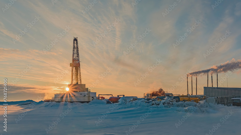 Drilling wells in an Arctic oil and gas field. Polar day sunrise in the ...