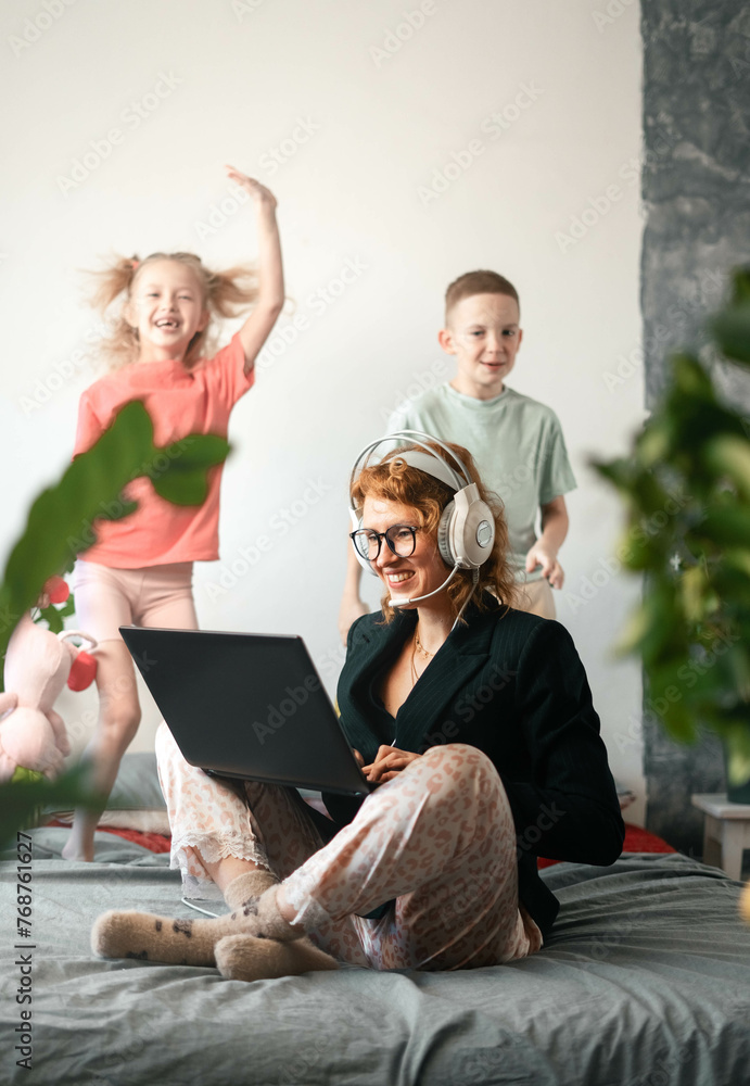 Remote work at home: A girl in a jacket and pajamas, a call worker ...