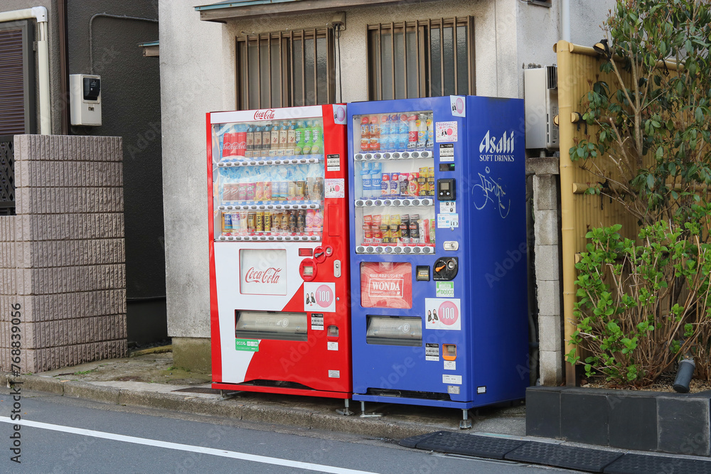 TOKYO, JAPAN - March 24, 2022: Two drinks vending machines (one Coca ...