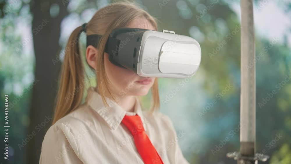 Person with sword posing at camera. Young woman in school uniform in vr ...