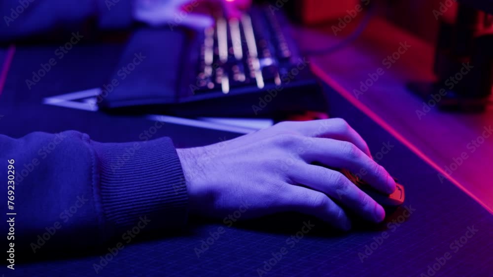 Male hands pushing buttons on computer mouse close-up. Gamer typing on ...