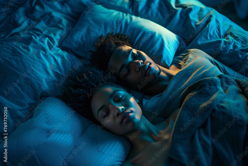 top view couple sleeping in bed at night. husband and wife cuddling ...