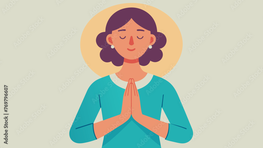 A persons palms pressed together in front of their chest in a prayer ...