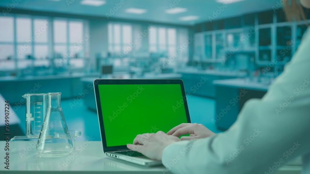 Laptop with Green Screen on Research Biochemistry lab Desk. Advertising ...
