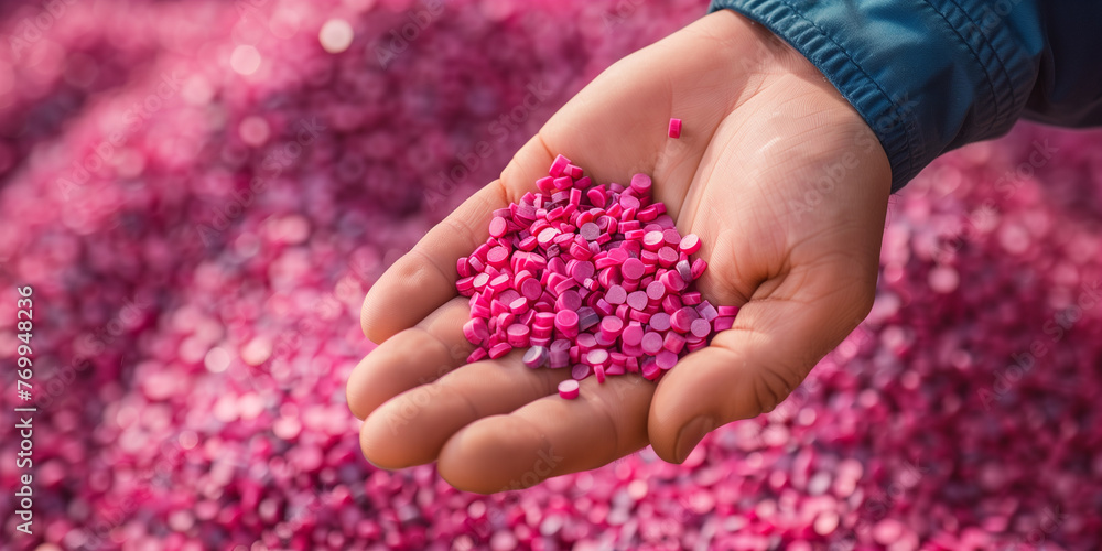 Hand Holding Pink Plastic Resin Pellets for Plastic Manufacturing ...
