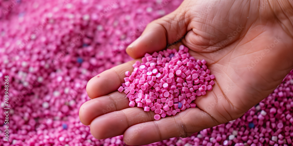 Hand Holding Pink Plastic Resin Pellets for Plastic Manufacturing ...