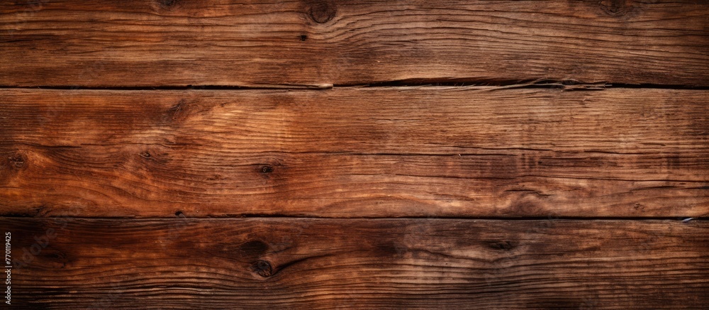 A closeup of a brown hardwood table, showcasing a beautiful amber wood ...