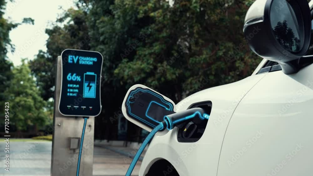 Electric car recharging battery by futuristic smart EV charger from eco ...