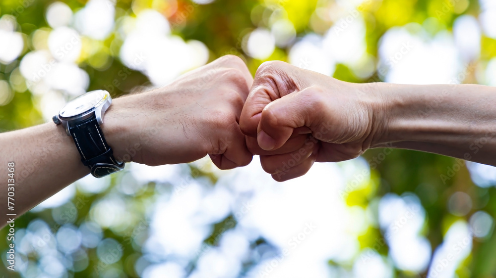 Deal of teamwork with the Man hand a fist bump commit as get together ...
