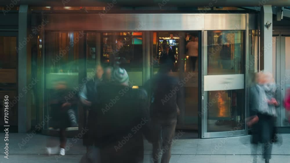 Time-lapse busy shopping mall entrance unrecognizable people crowd ...