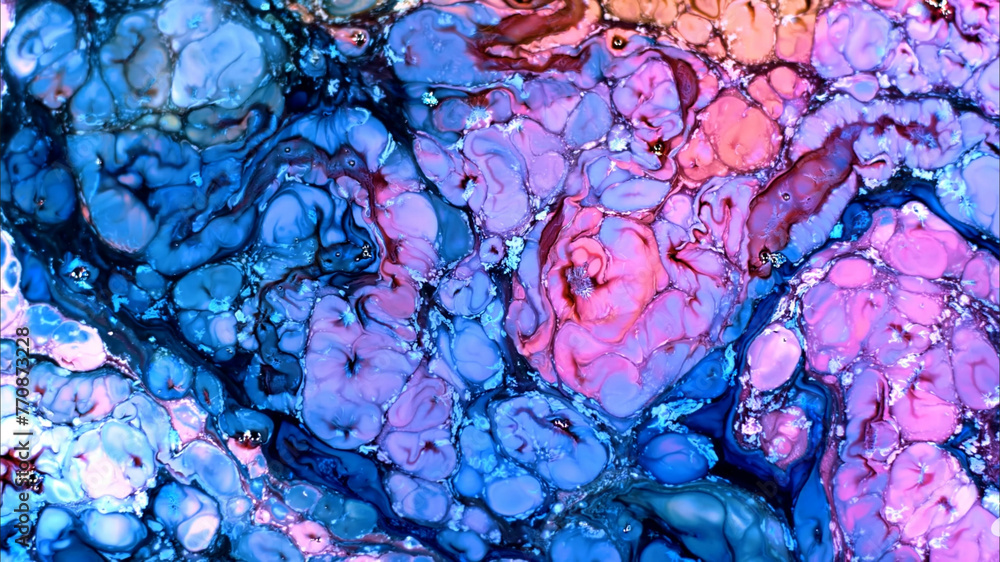 Psychedelic abstract bright multiple colors are mixed in a liquid ...