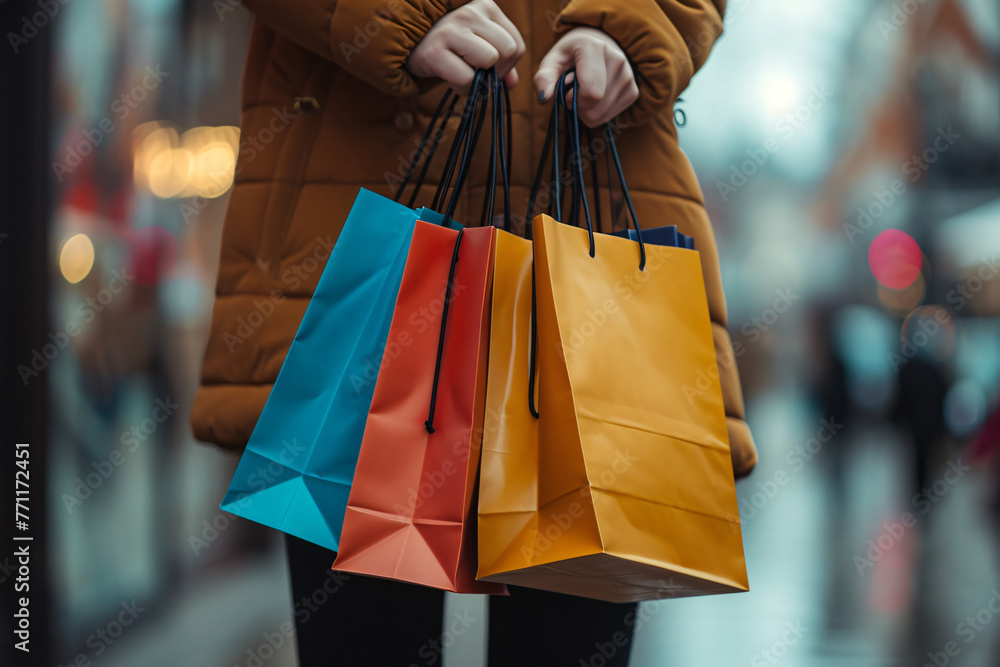 person holding shopping bags with different colors in t acd1b13c-8fe5 ...