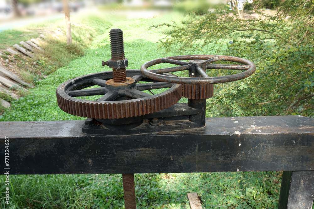 Cogs control the water gates valve to opening and closing for prevent ...