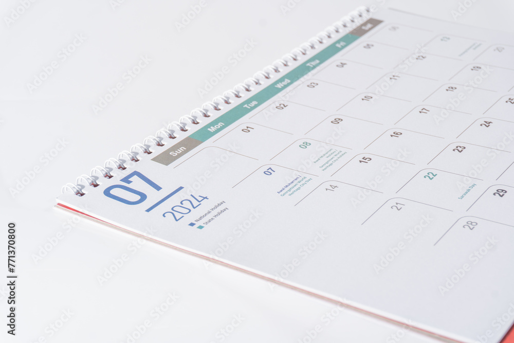 Desk calendar of 2024 laying on white background. July page of 2024 ...