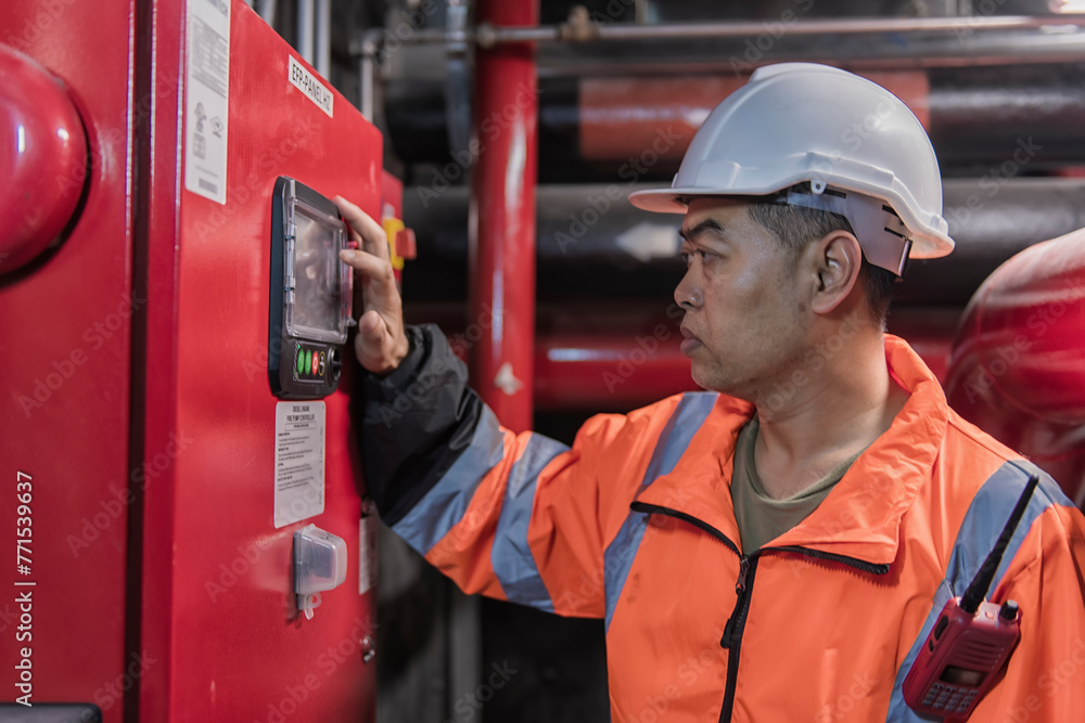Engineer checking Control Panel of fire engine pump in room. engineer ...