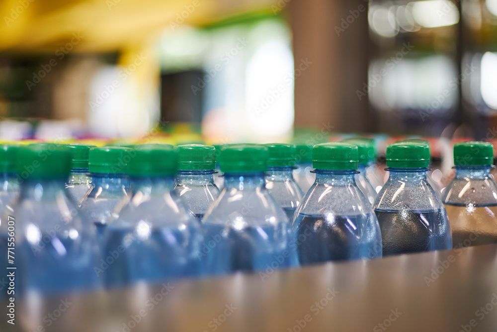 Blue plastic half liter small volume mineral water bottles with green ...