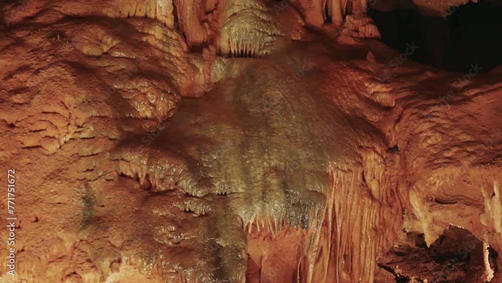 Explore vibrant stalagmites in underground cave, showcasing cave ...