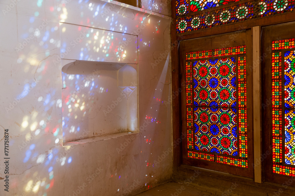 Colorful stained glass window in the ancient Persian Dowlatabad mansion ...
